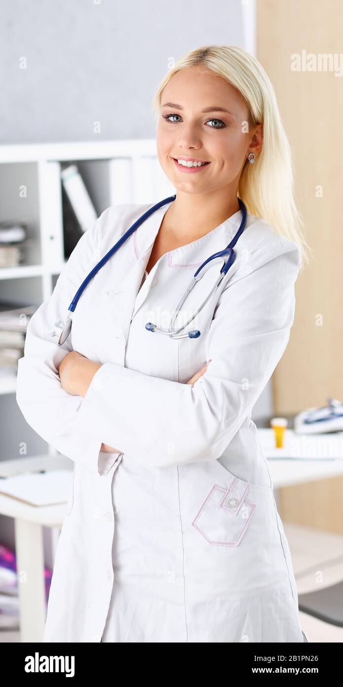 Beautiful smiling female doctor stand in office portrait Stock Photo ...