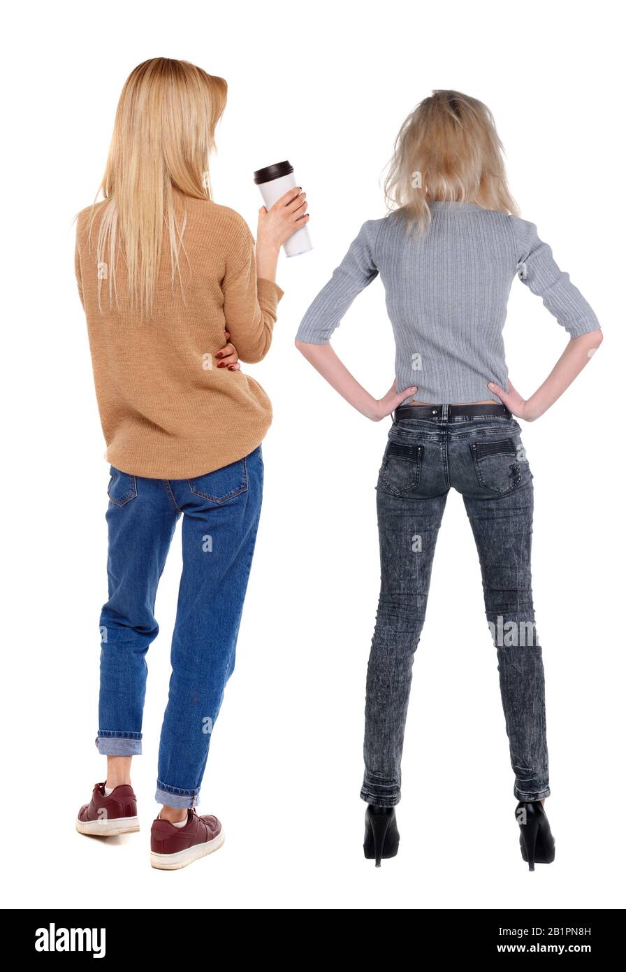 Back view of two woman in sweater. Rear view people collection ...