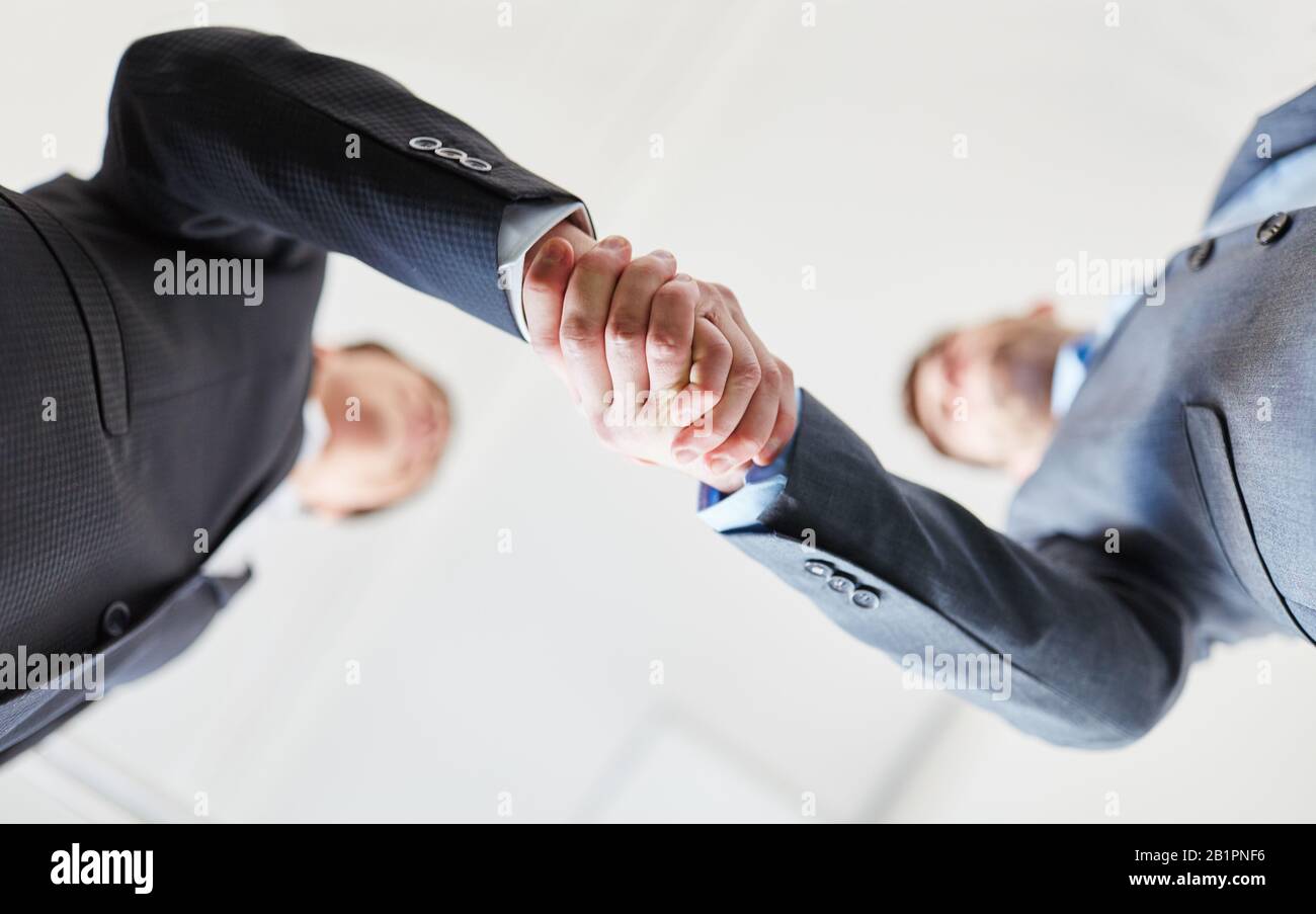 Two successful business people make a business handshake Stock Photo ...