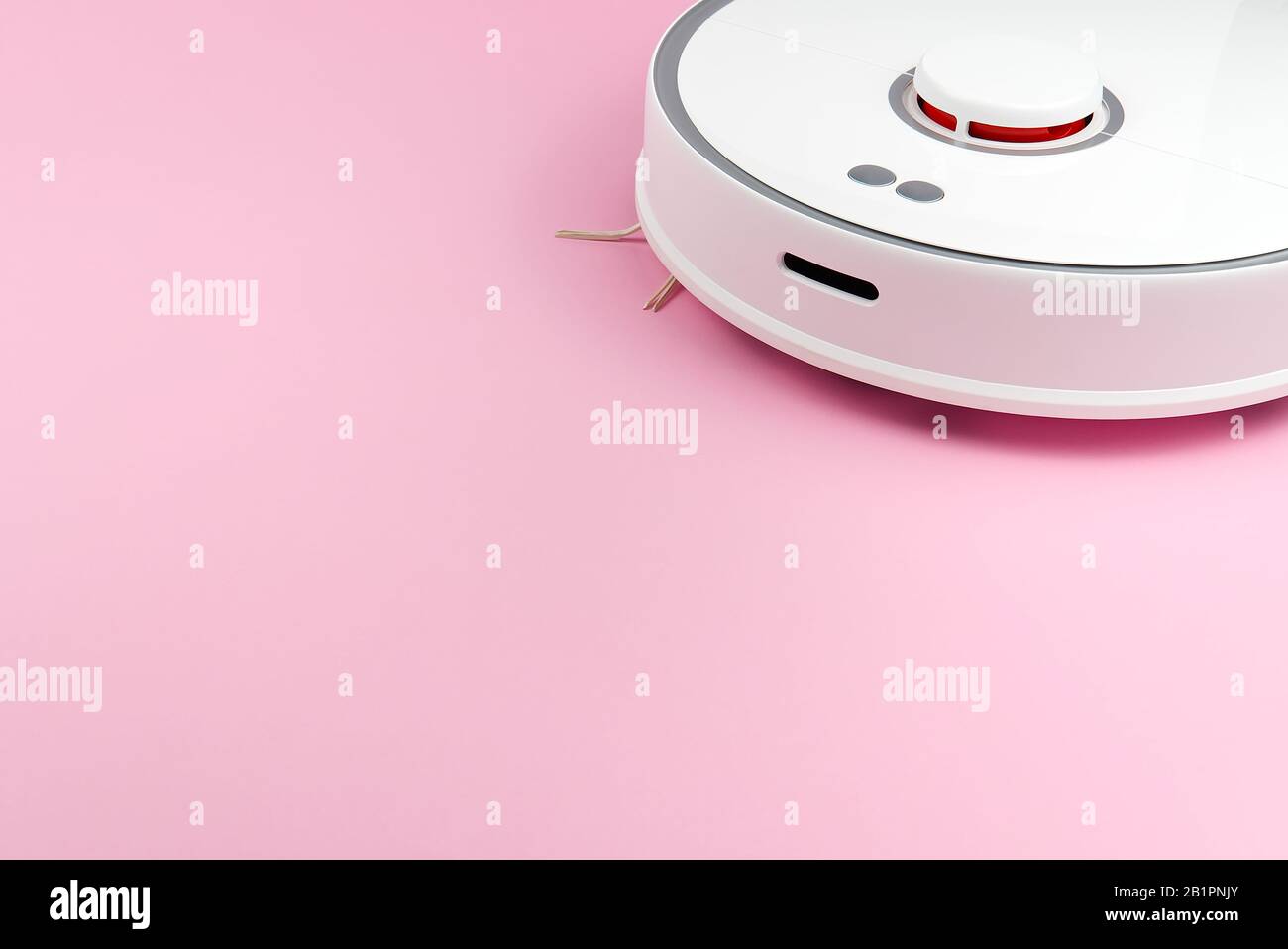 white Robotic vacuum cleaner isolated on pink background Stock Photo ...