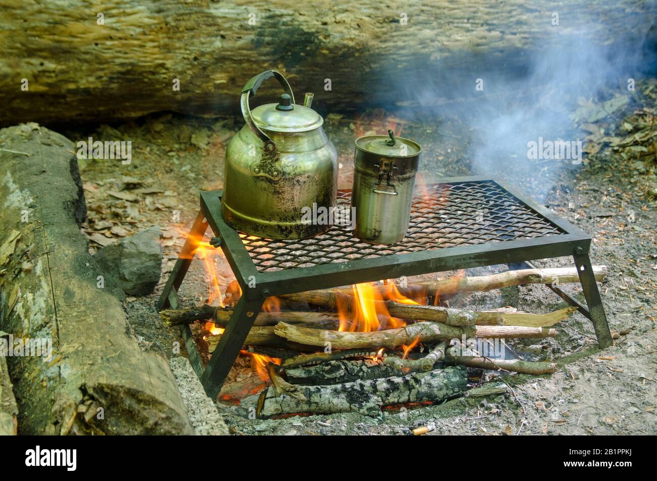 Cooking Tea in Camping Stock Photo - Alamy
