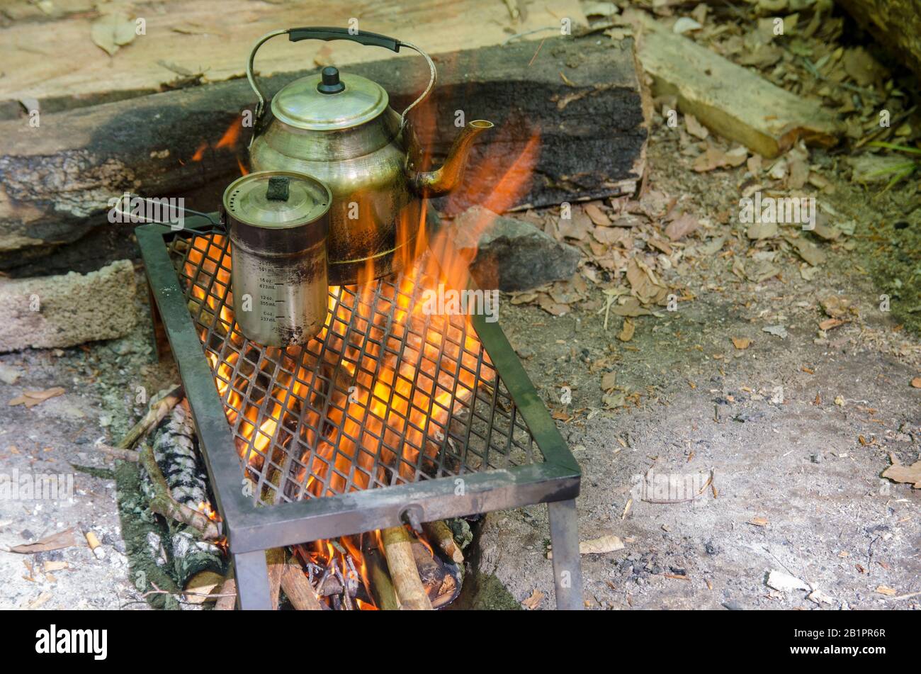 Cooking Tea in Camping Stock Photo - Alamy