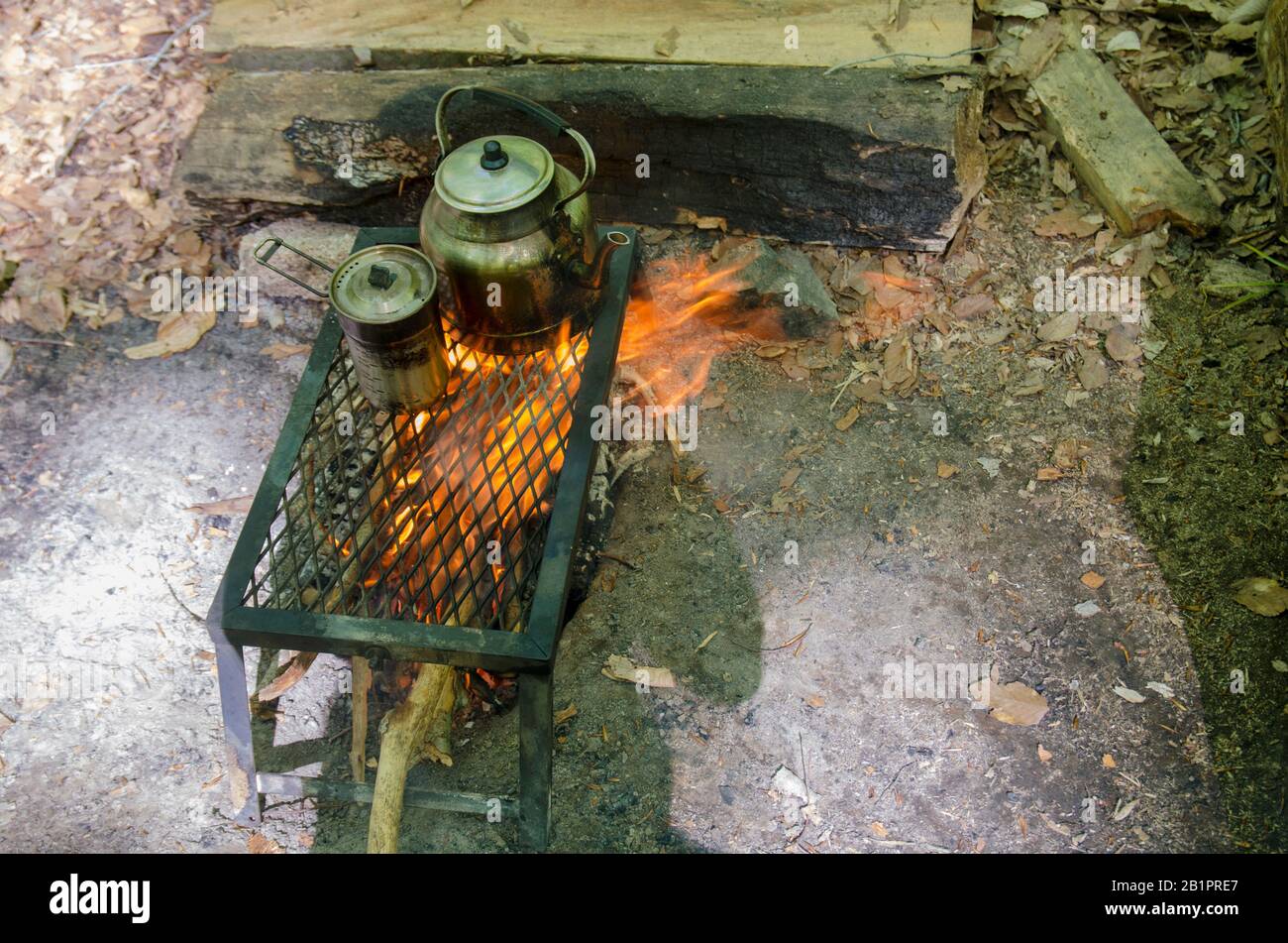 Cooking Tea in Camping Stock Photo - Alamy