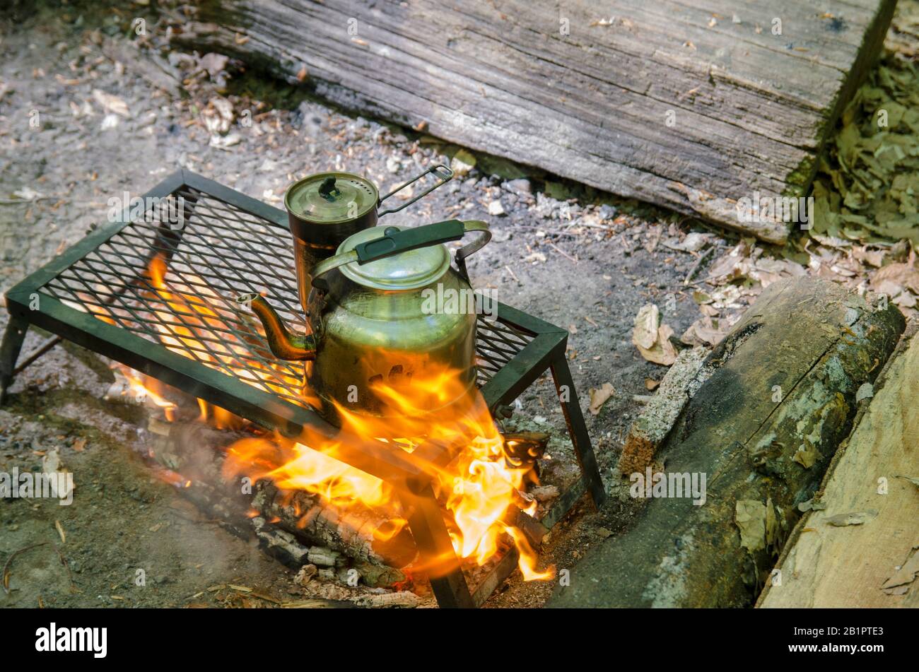 Cooking Tea in Camping Stock Photo - Alamy