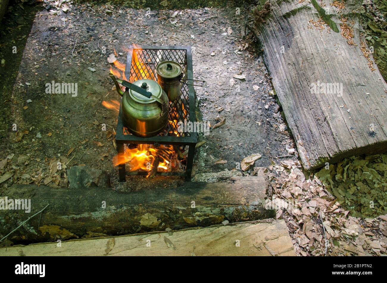 Cooking Tea in Camping Stock Photo - Alamy