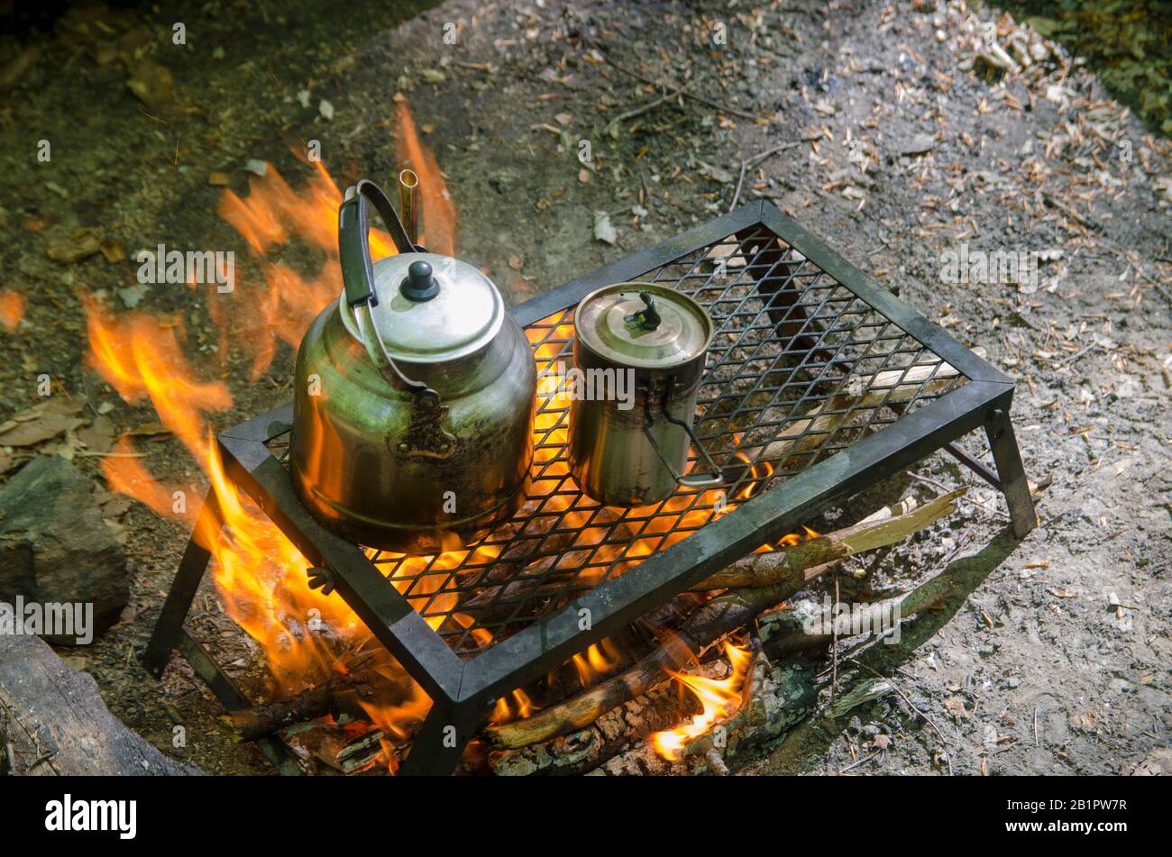 Cooking Tea in Camping Stock Photo - Alamy