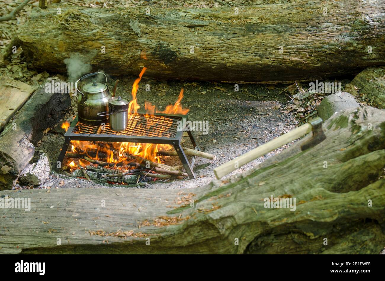 Cooking Tea in Camping Stock Photo - Alamy