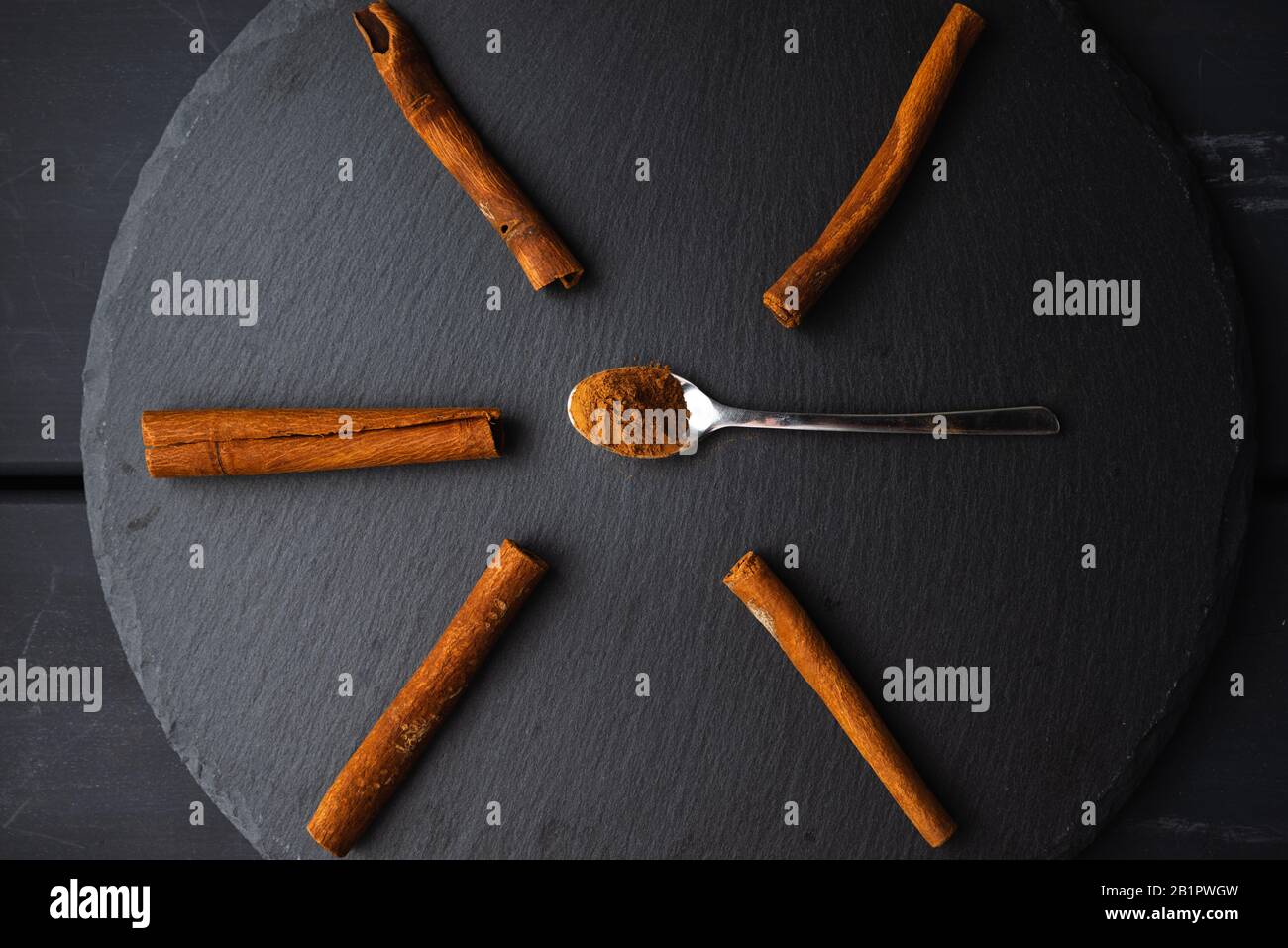 cinnamon spice on a teaspoon Stock Photo - Alamy