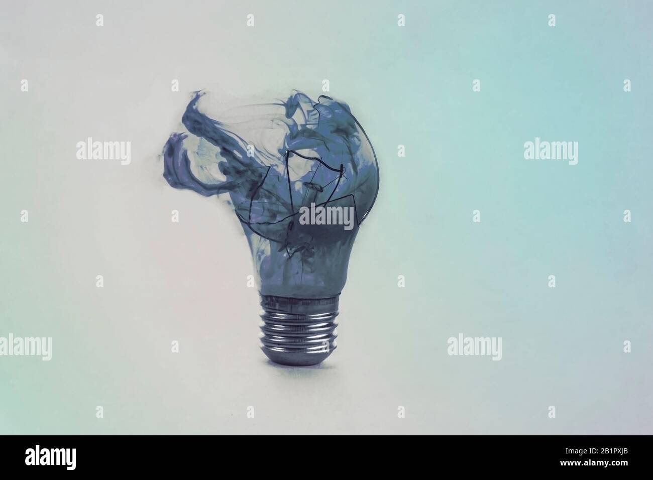 One broken light bulb on a blue background with smoke. Overdue idea ...