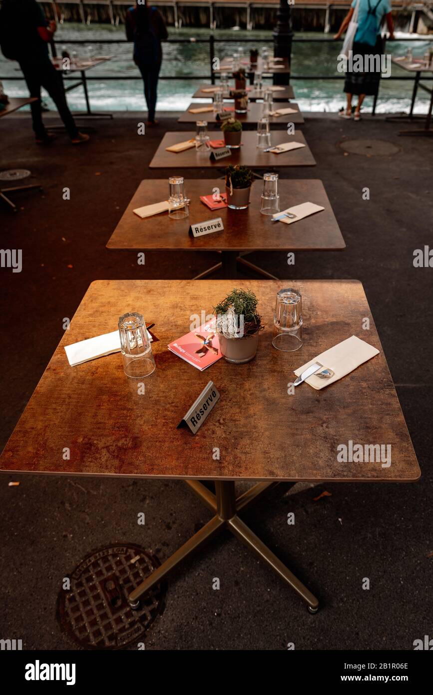free table in an outdoor restaurant Stock Photo - Alamy