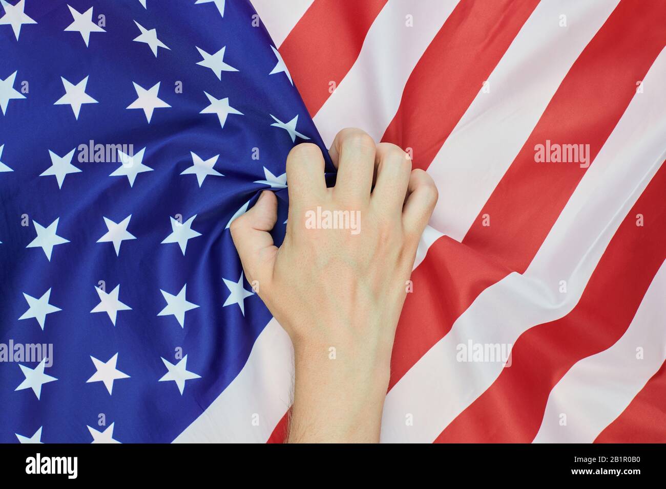 Hand crumpled national USA american flag. Revolutionary political truth ...