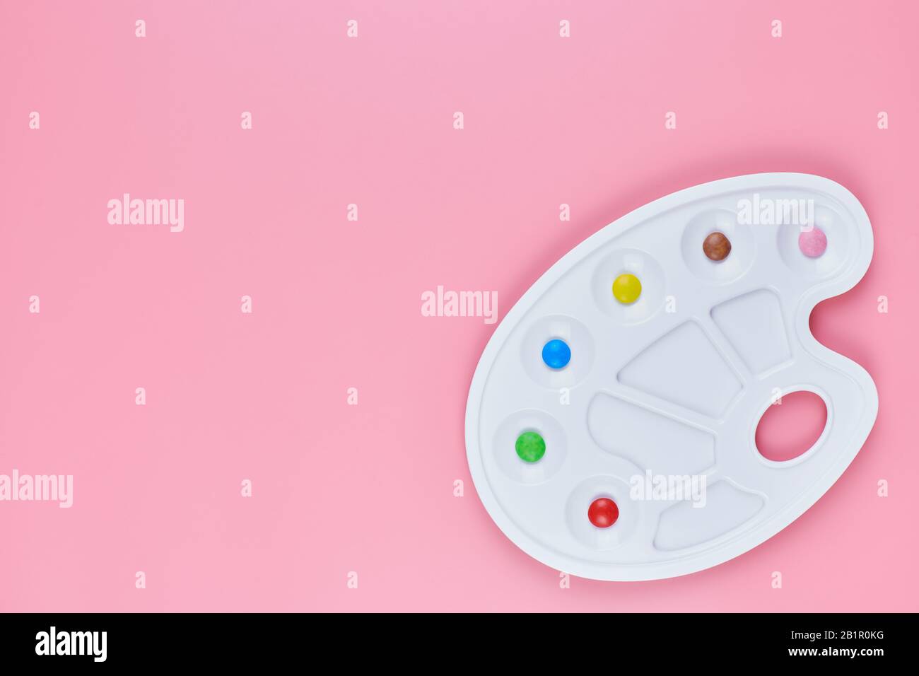 Art of sweetmeats concept, copy space. Sweet candy in paint palette on ...