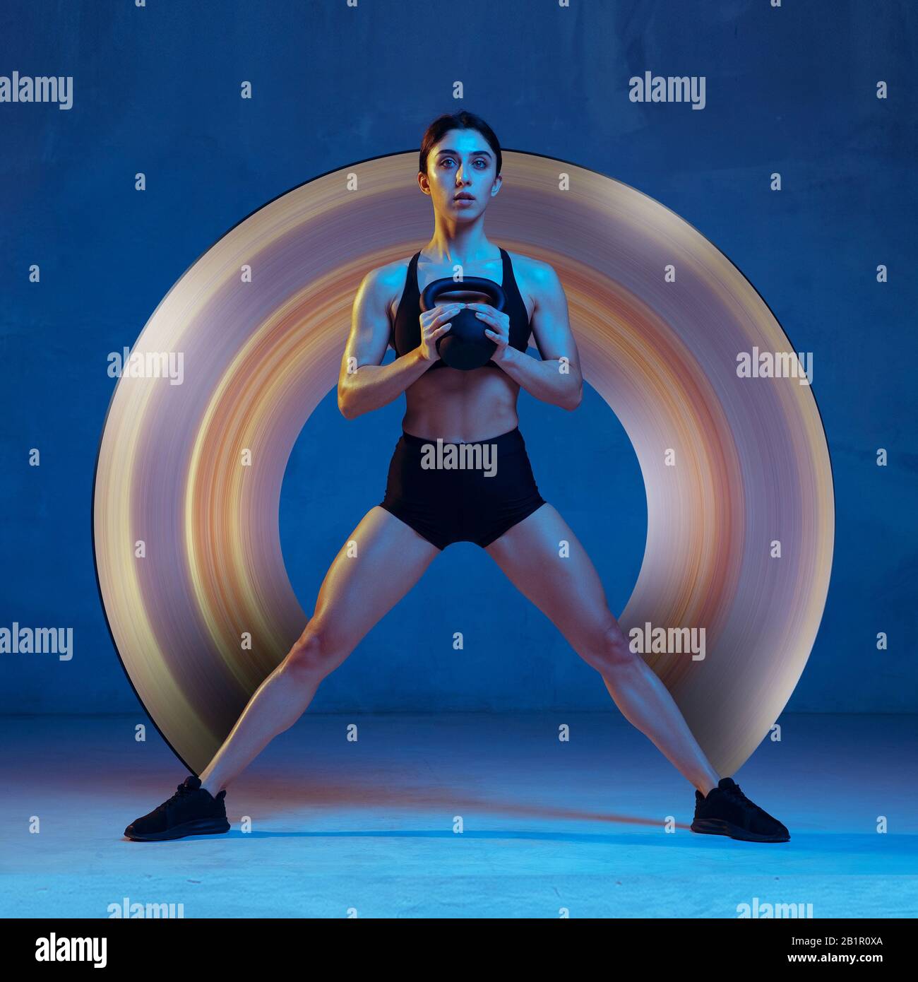 Concept of motion and action in sport. Young female athlete training ...