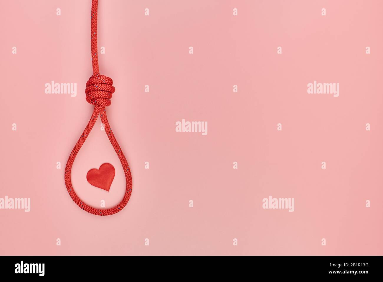 Heart in hangman's knot, copy space. Unrequited love hanging suicide ...