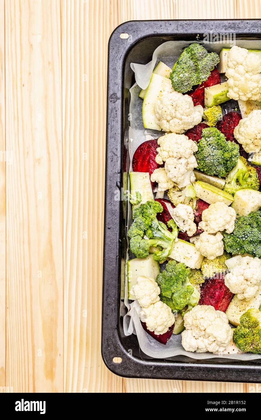 Assorted fresh vegetables on a baking tray. Cauliflower, broccoli, beet ...