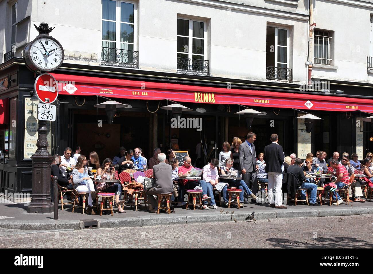 PARIS, FRANCE - JULY 24, 2011: People visit Cafe Delmas in Paris ...
