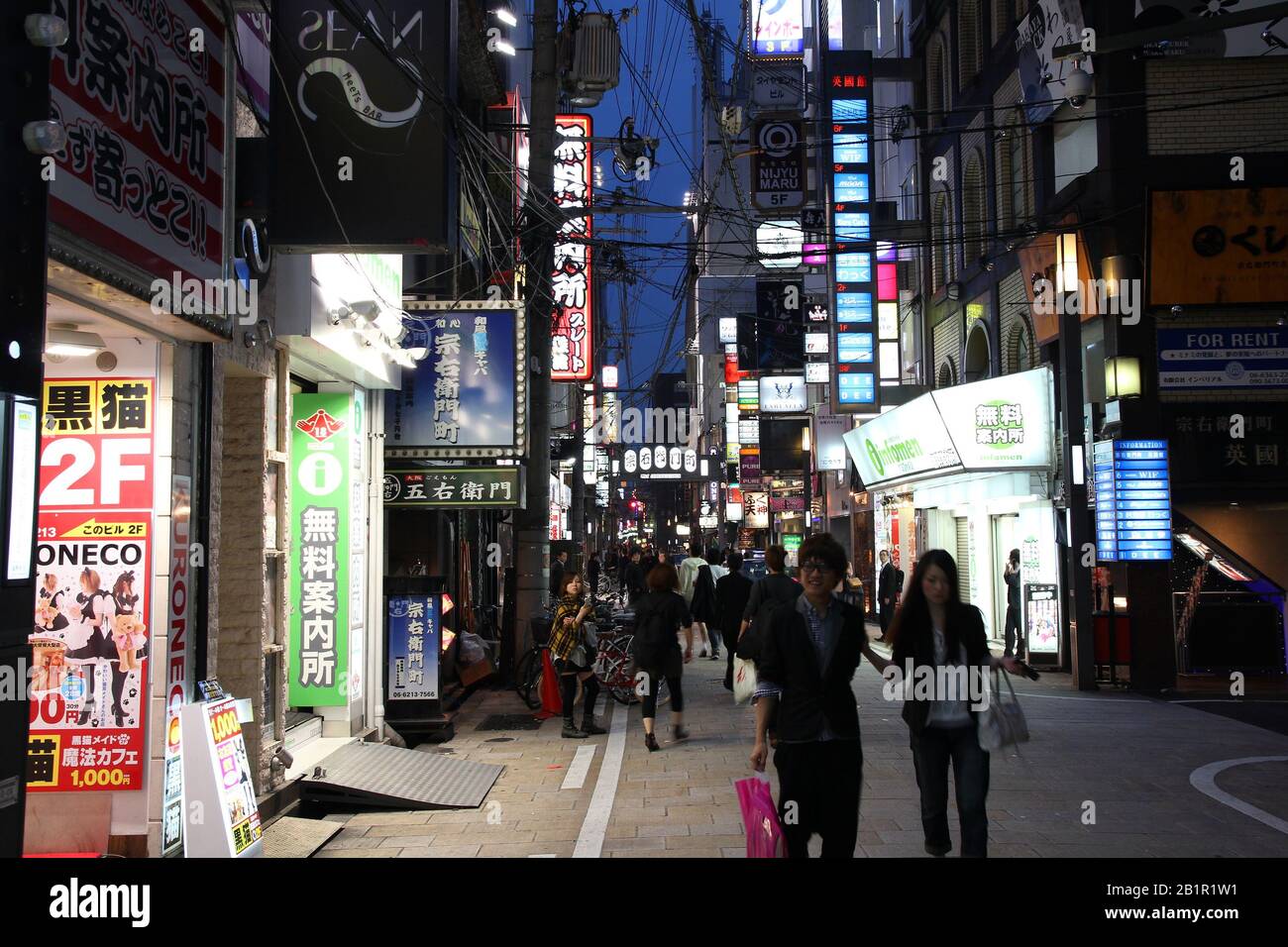 OSAKA, JAPAN - APRIL 25, 2012: Shoppers stroll in Namba area of Osaka ...