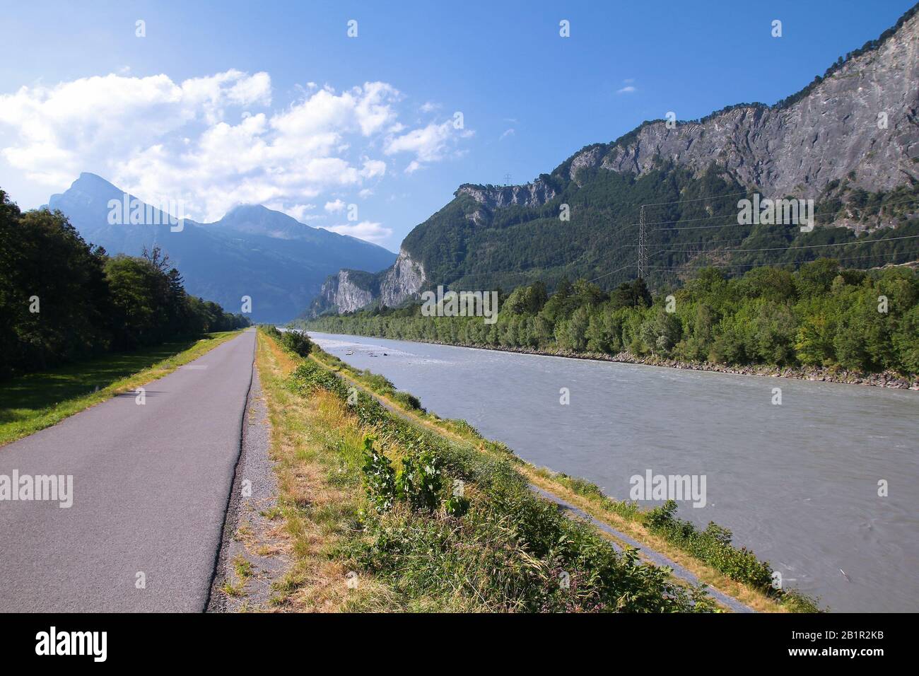 Cycling path along Rhine river in Switzerland. Mountain landscape Stock ...