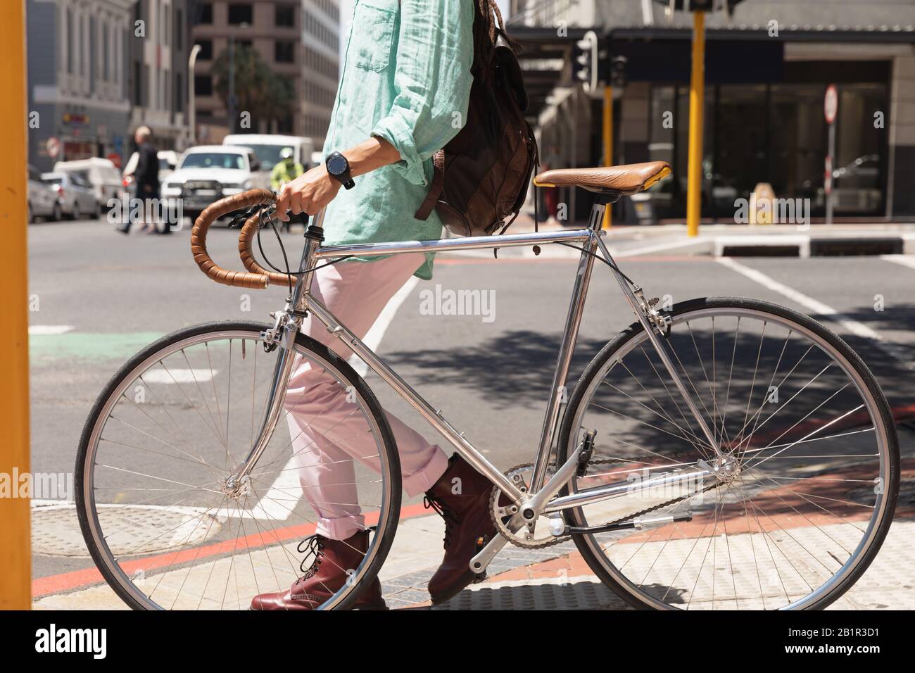 Man walking bike hi-res stock photography and images - Alamy