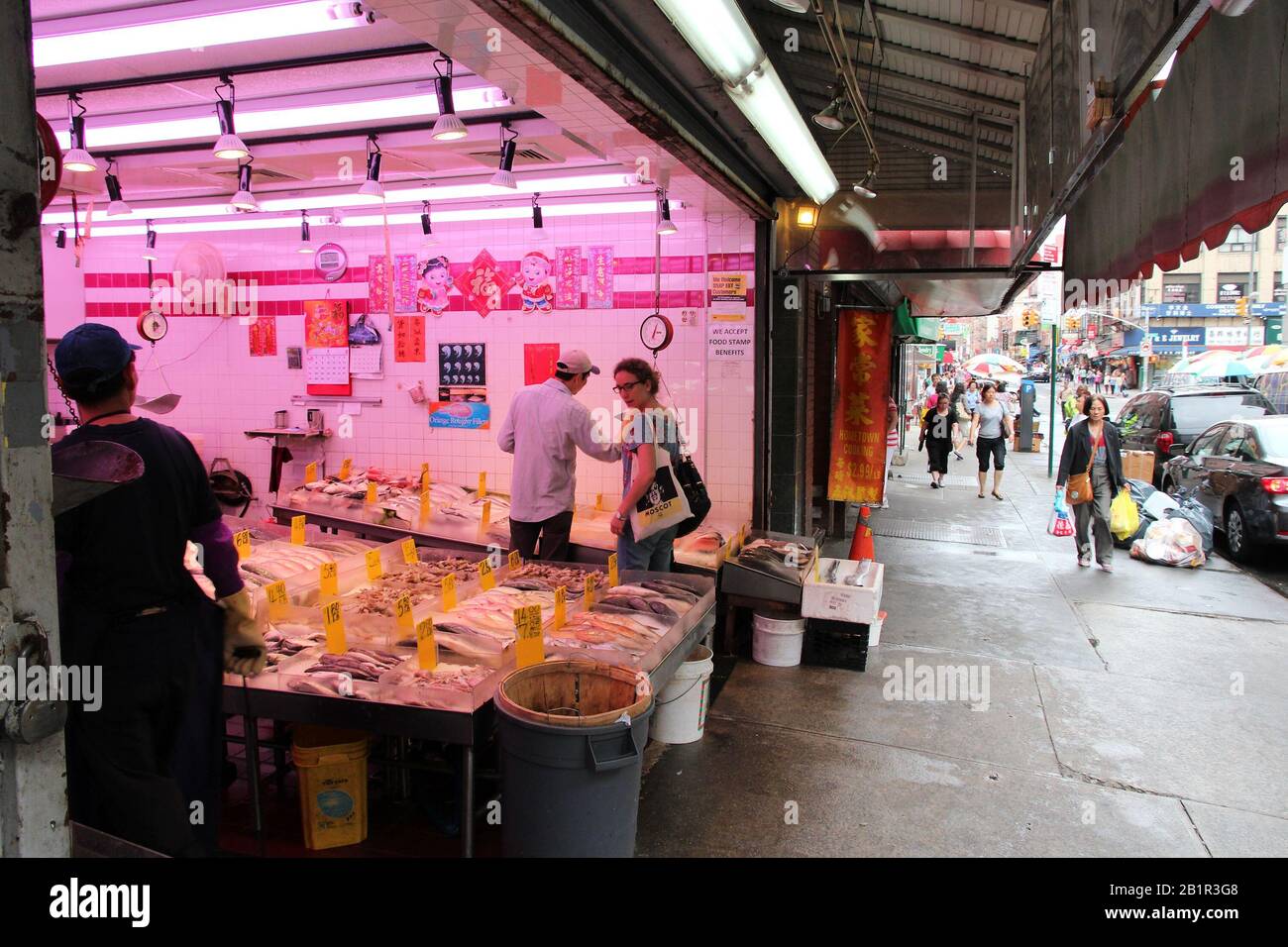 NEW YORK, USA - JULY 1, 2013: People visit food market in Chinatown in ...