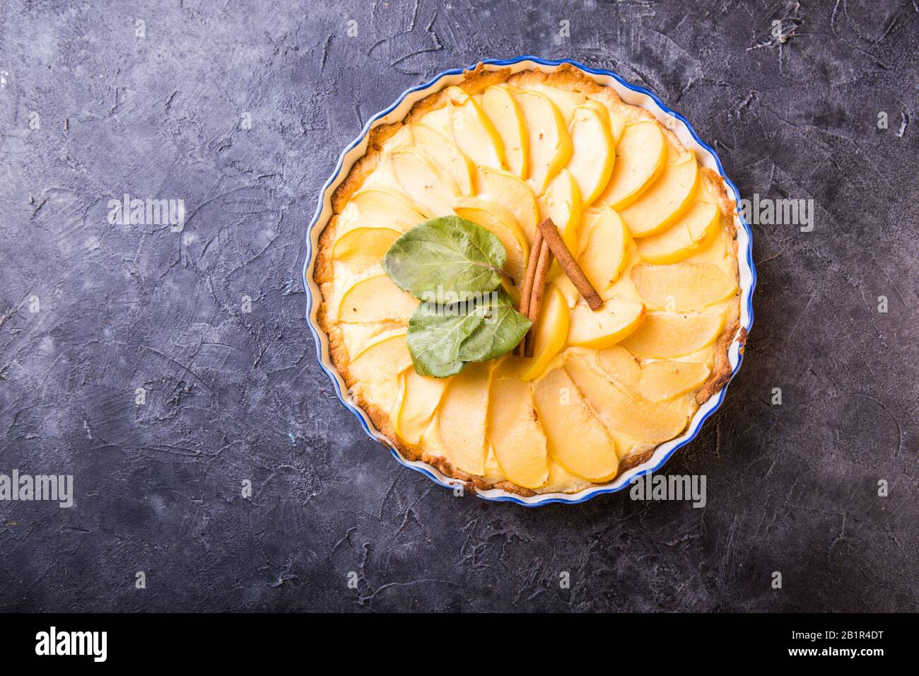 quince tart with custard open and shortcrust pastry and cinnamon Stock ...