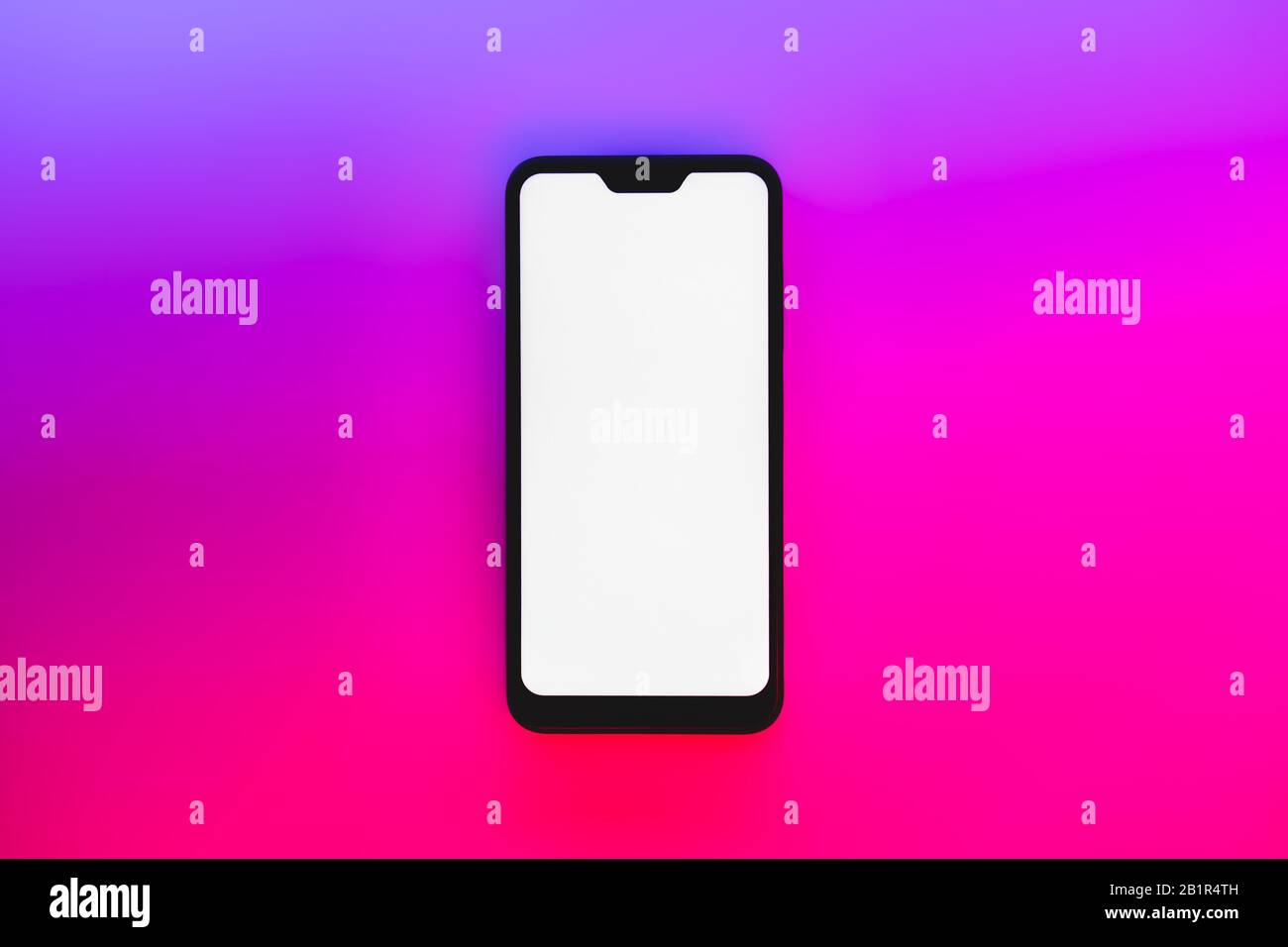 Modern generic smartphone in neon backdrop. Cellphone with white screen ...