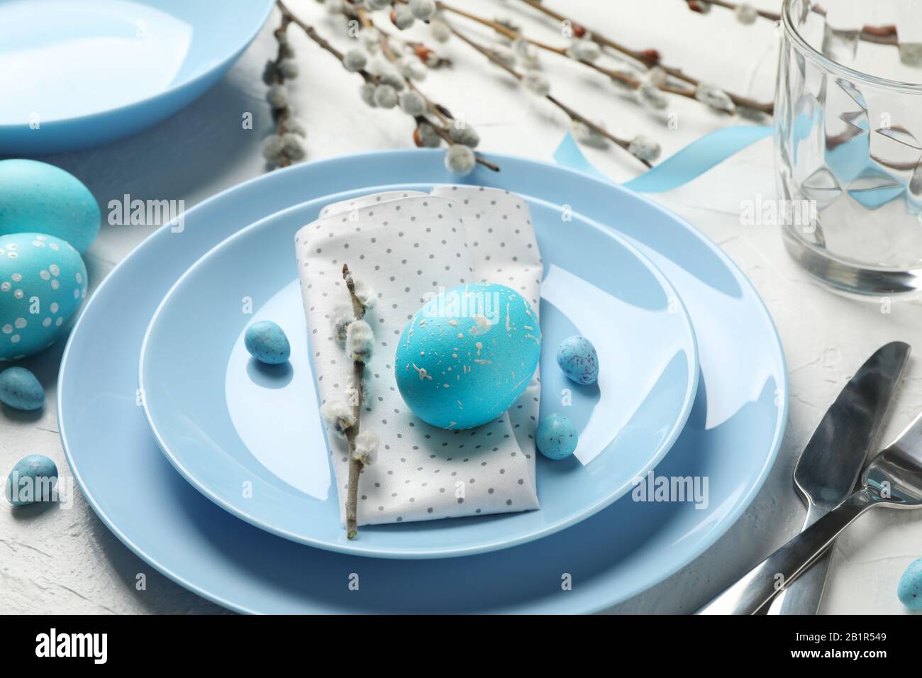 Easter table setting on white background, close up Stock Photo - Alamy