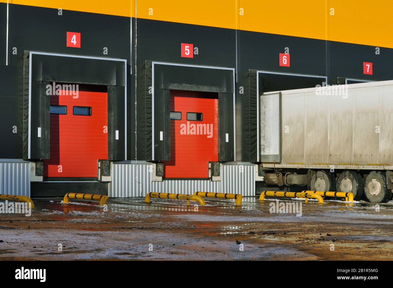 Loading vehicles at the logistics center. Loading docks of the ...