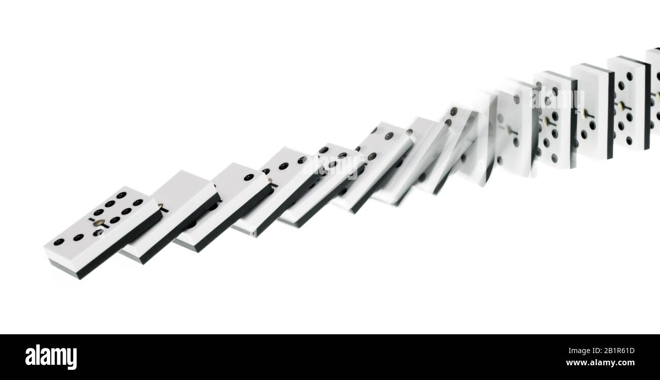 Dominoes falling in chain reaction hi-res stock photography and images ...