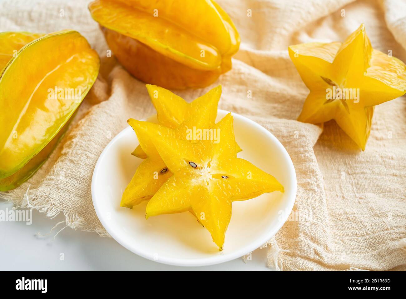 Golden yellow fresh carambola and pulp slices Stock Photo - Alamy