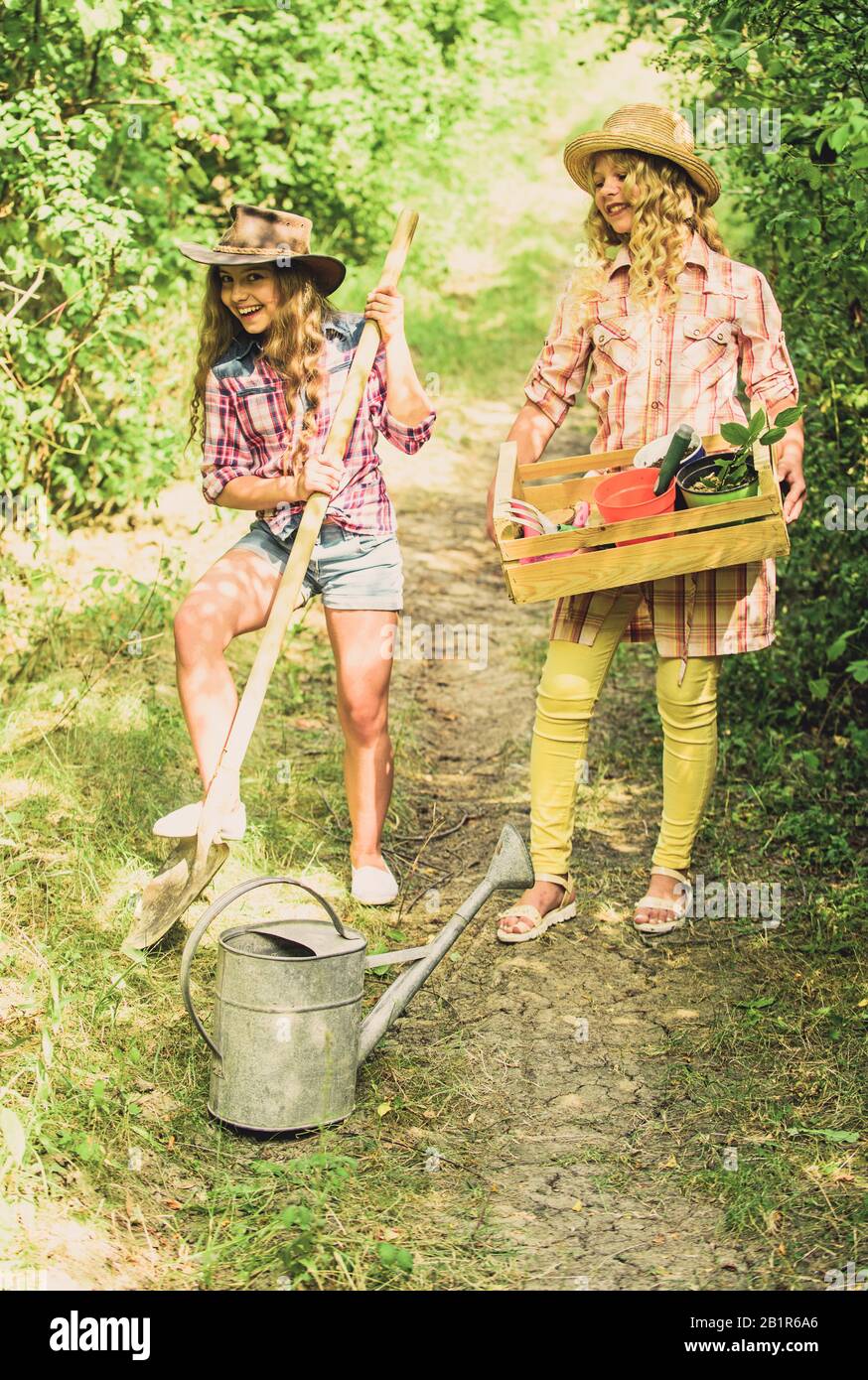Kids girls with tools for gardening. Gardening basics. Gardening ...
