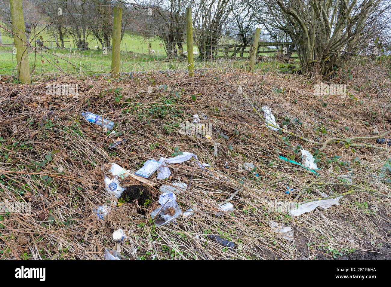 Litter and waste discarded at a layby on a rural road in Wales Stock ...