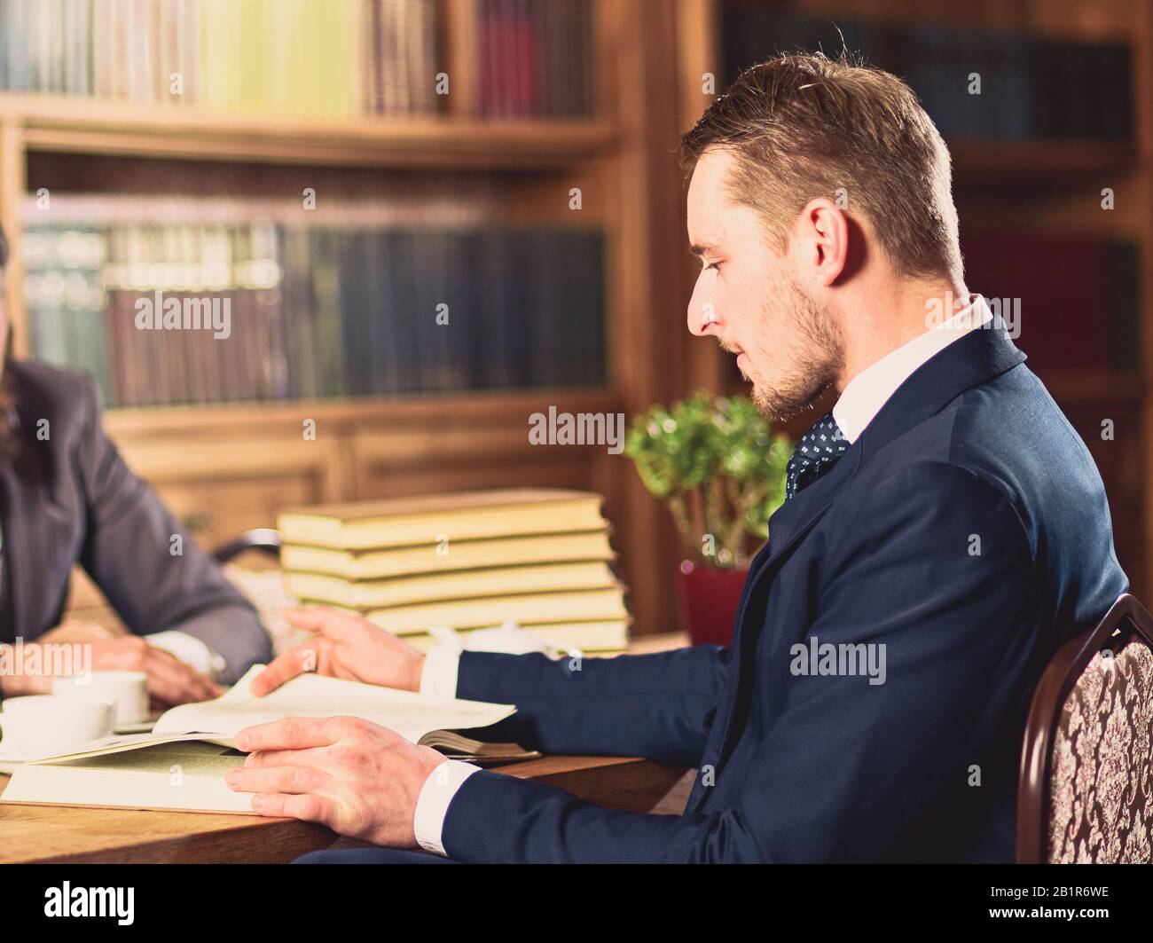 Science and studying concept. Man in classic suit or professor with ...