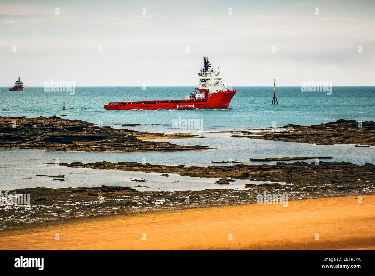 red ship approaching the coast, Australia Stock Photo - Alamy