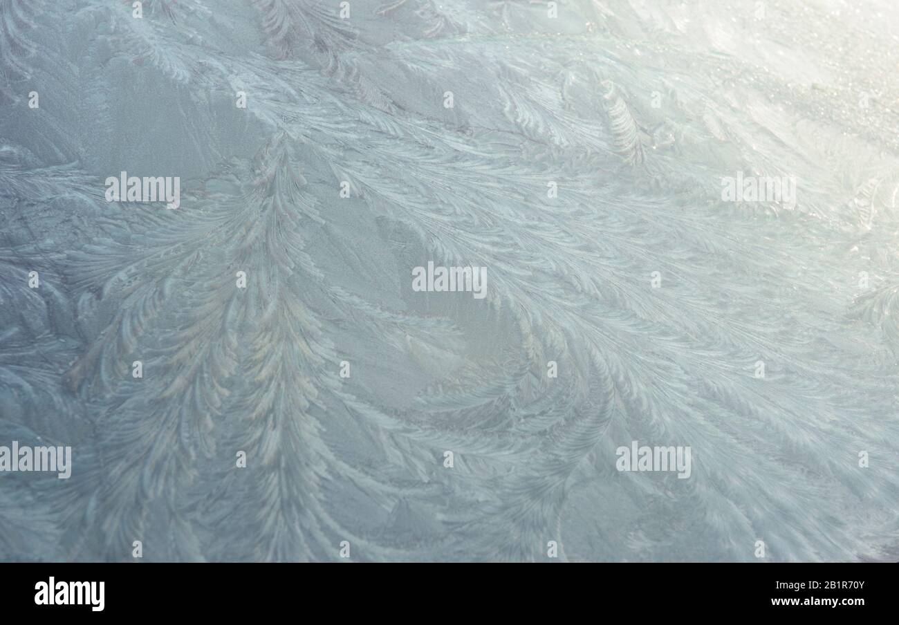 Ice and frost patterns formed on the windscreen of a car Stock Photo ...