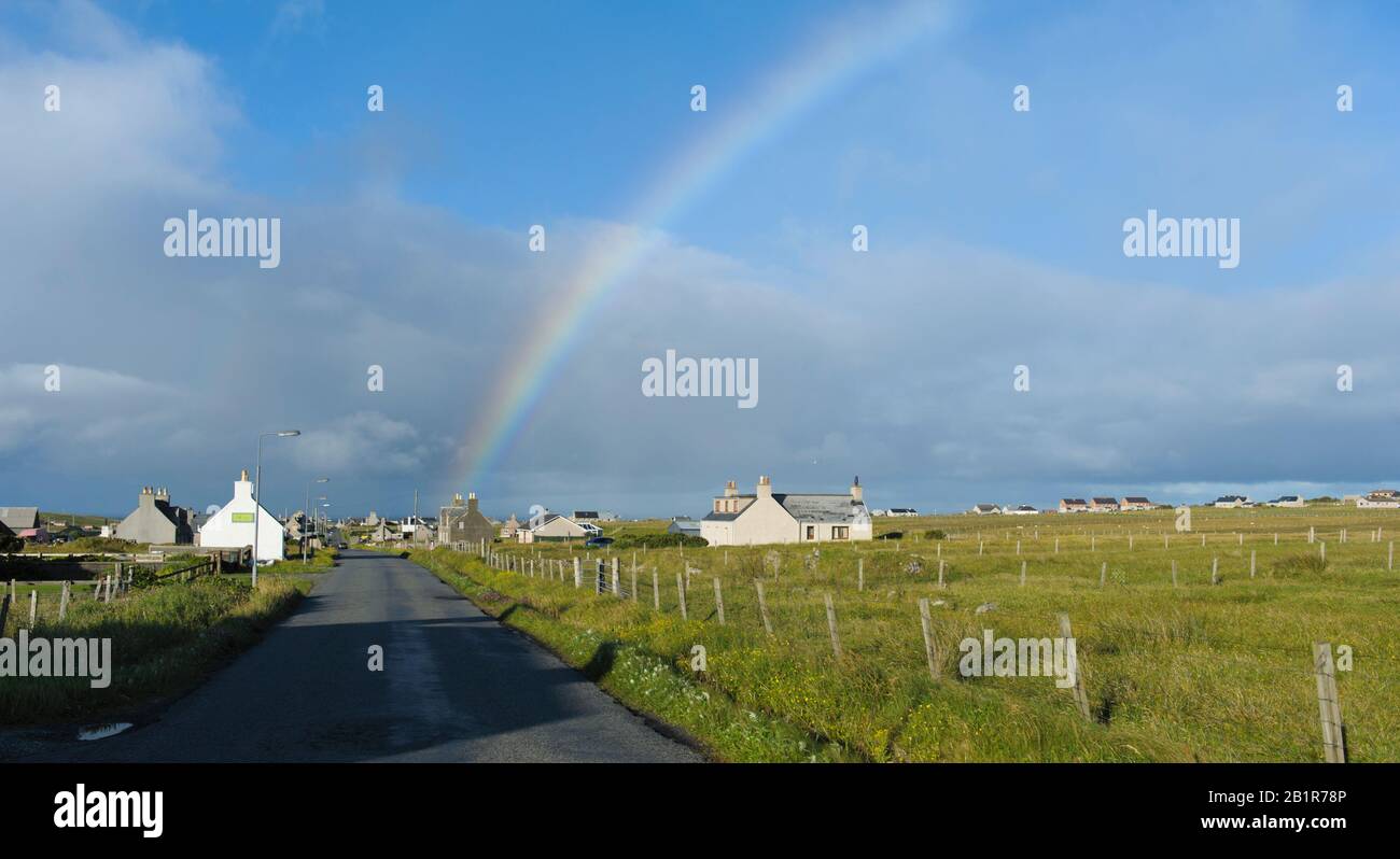 A rainbow above the remote crofting community of Habost, Port of Ness ...