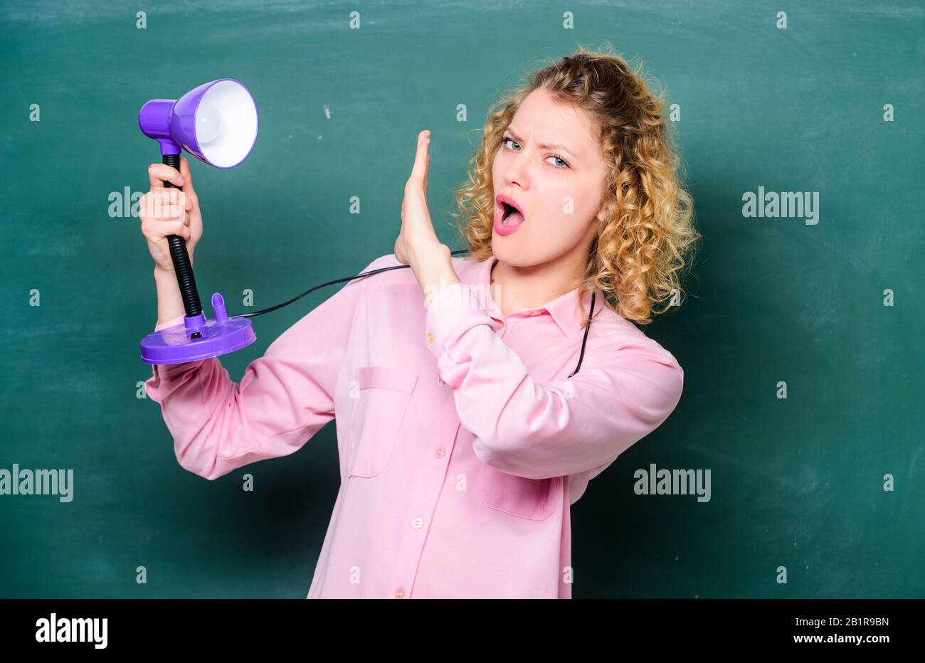 ray of light. education concept. back to school. teacher with lamp at ...