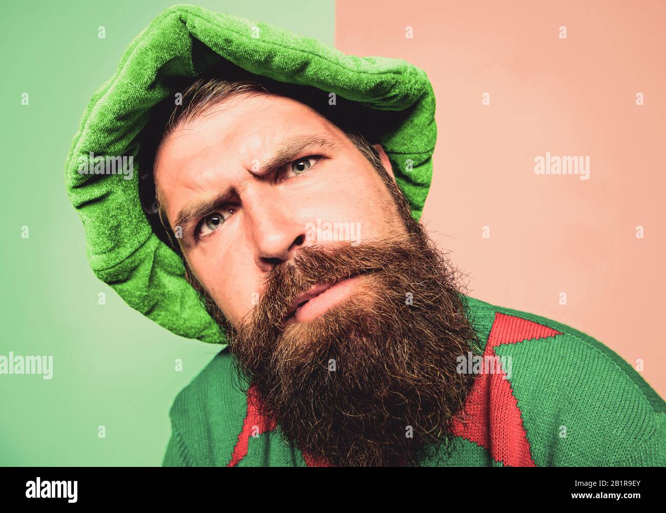 Who is there. Picky man looking at camera. Bearded elf. Winter carnival ...