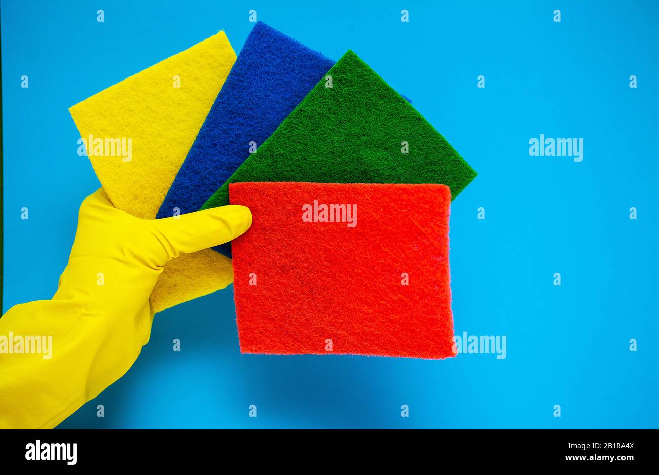 Product for professional cleaning on blue background Stock Photo - Alamy
