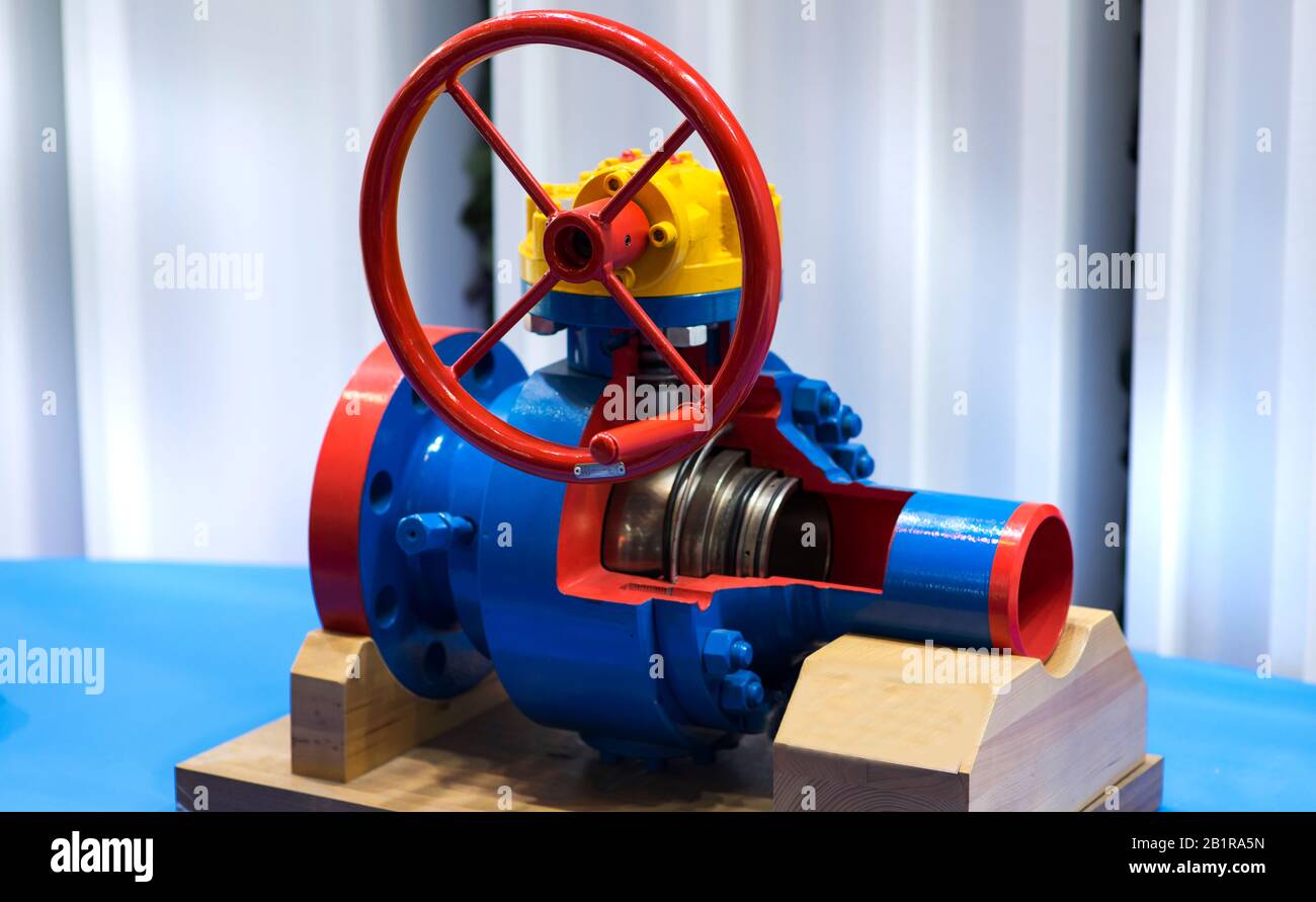 Close up of manual operate blue metal ball valve and pipes industrial ...