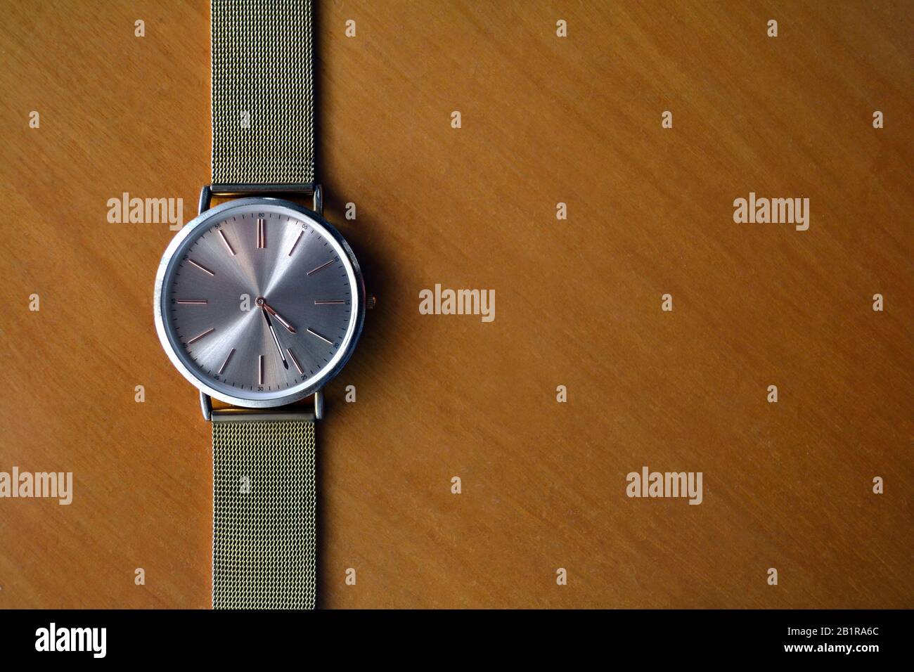 Gold watch in the left side Stock Photo - Alamy
