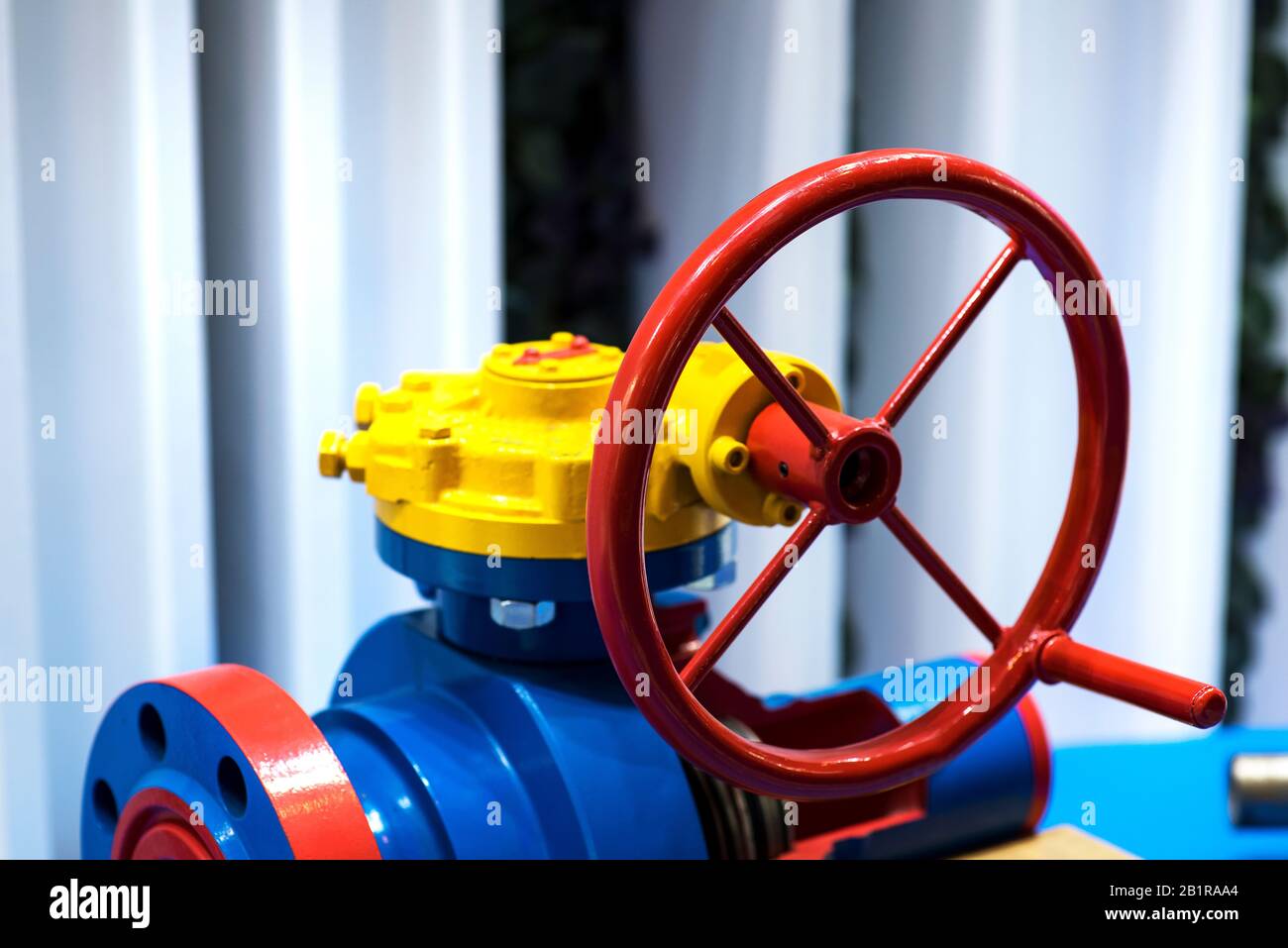 Close up of manual operate blue metal ball valve and pipes industrial ...
