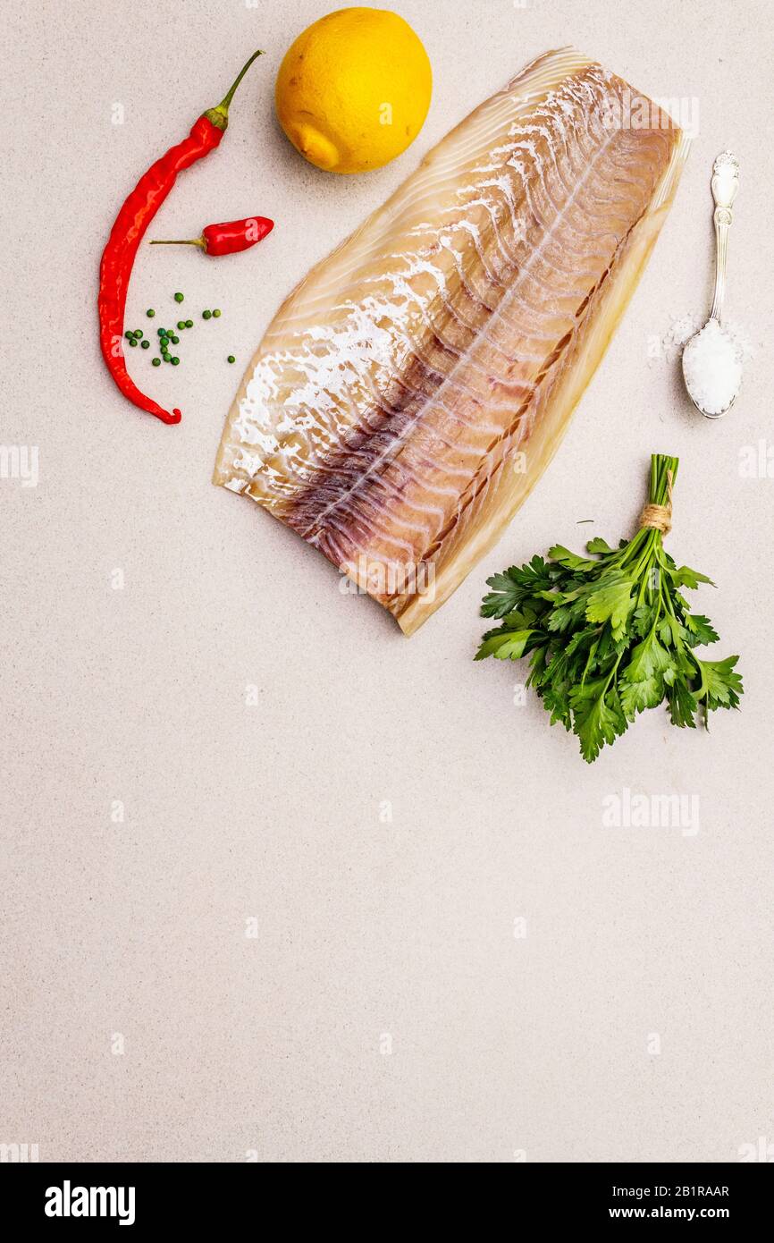 Raw cod loin fillet with lemon, sea salt, chili and cayenne pepper ...