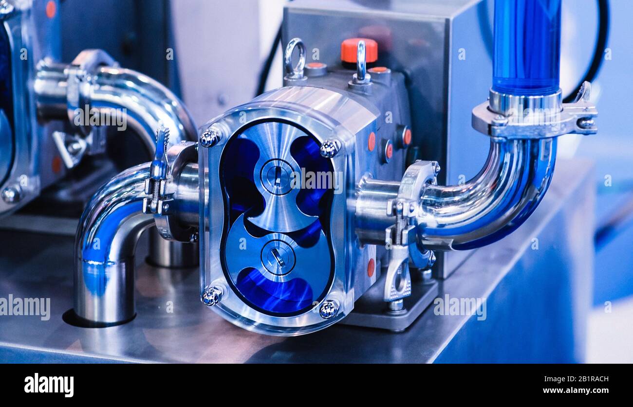 Operator machining automotive part by turning machine, Industry machine ...