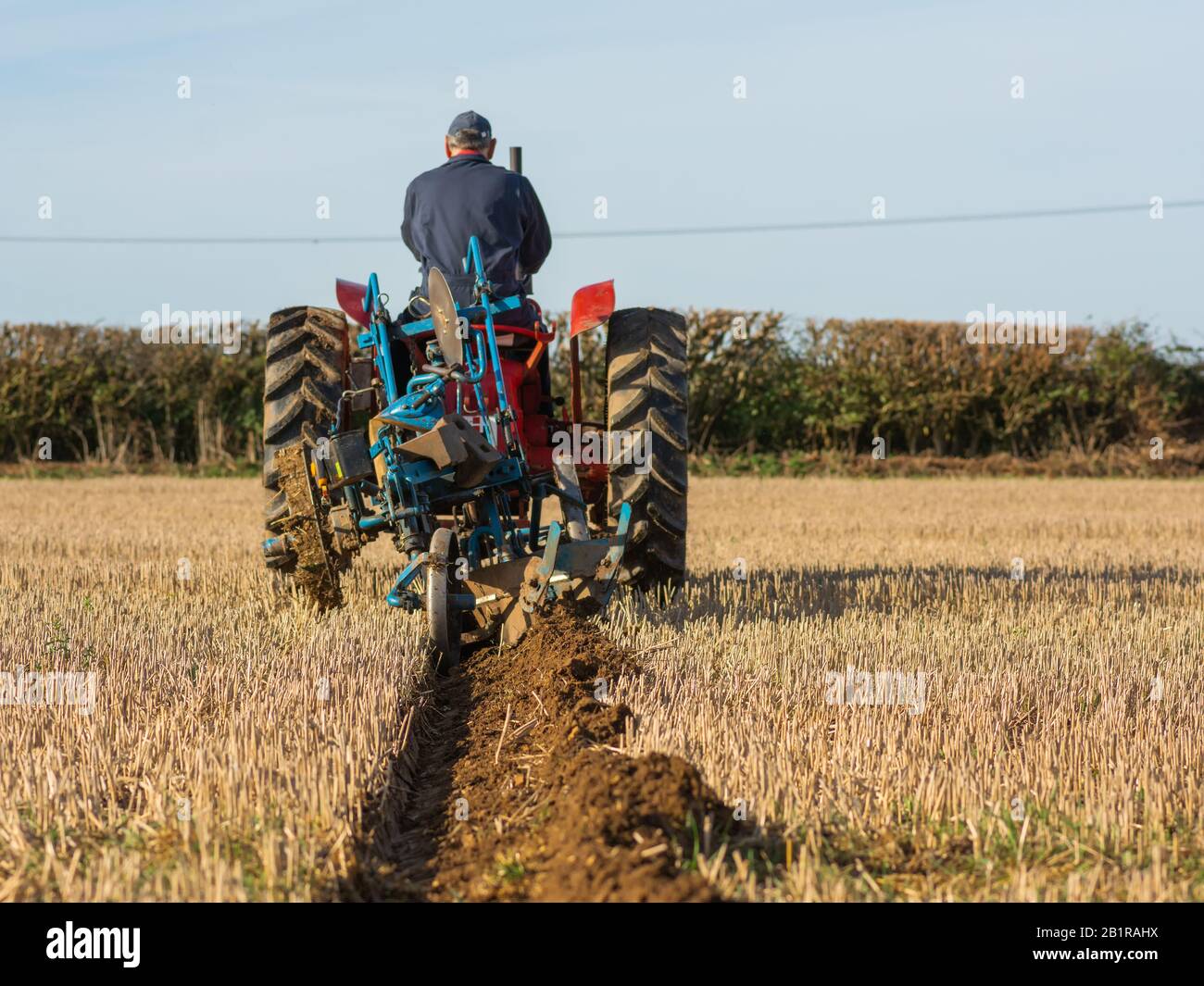Vintage class red Tractor Ploughing furrow field plough England Farming ...