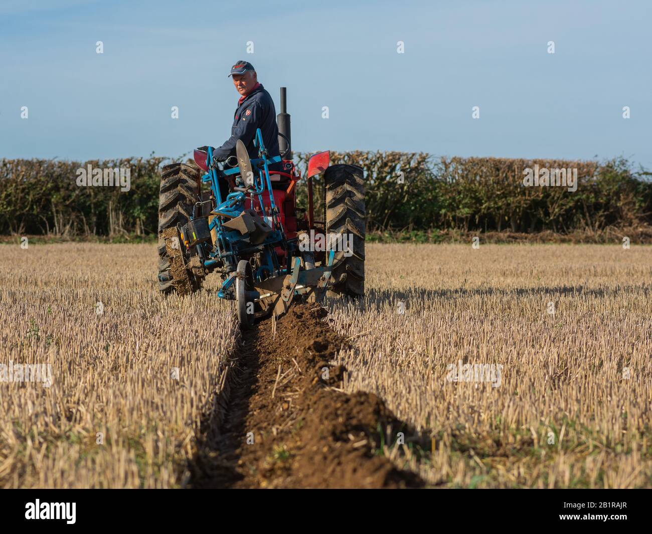 Vintage class red Tractor Ploughing furrow field plough England Farming ...