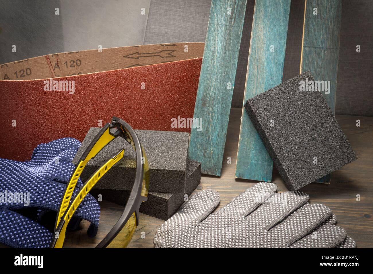 Various grinding tools - sanding belt, abrasive sponge and flap disc ...