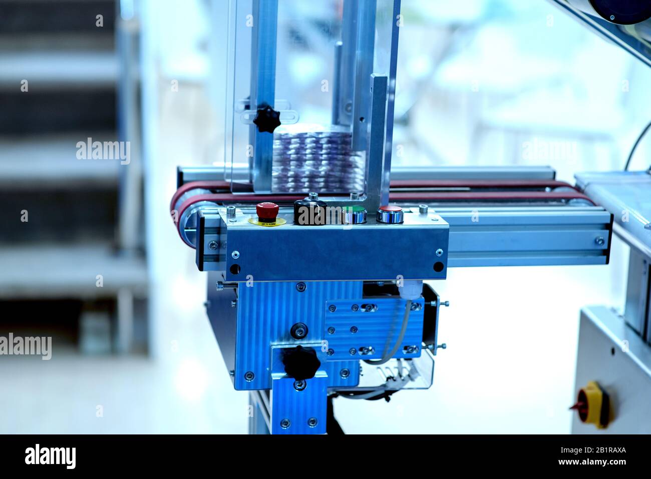 Rotary die cutting machine with slitting blade system Stock Photo - Alamy