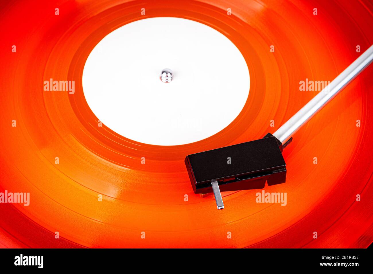 Close up of turntable cartridge on a vinyl record. Turntable playing ...