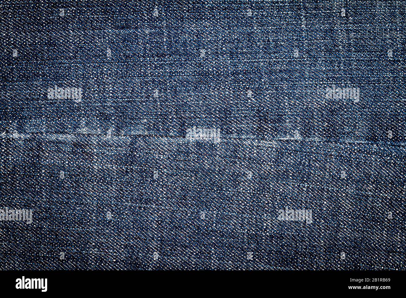 Dark blue jeans texture. Denim fabric background with a seam Stock ...